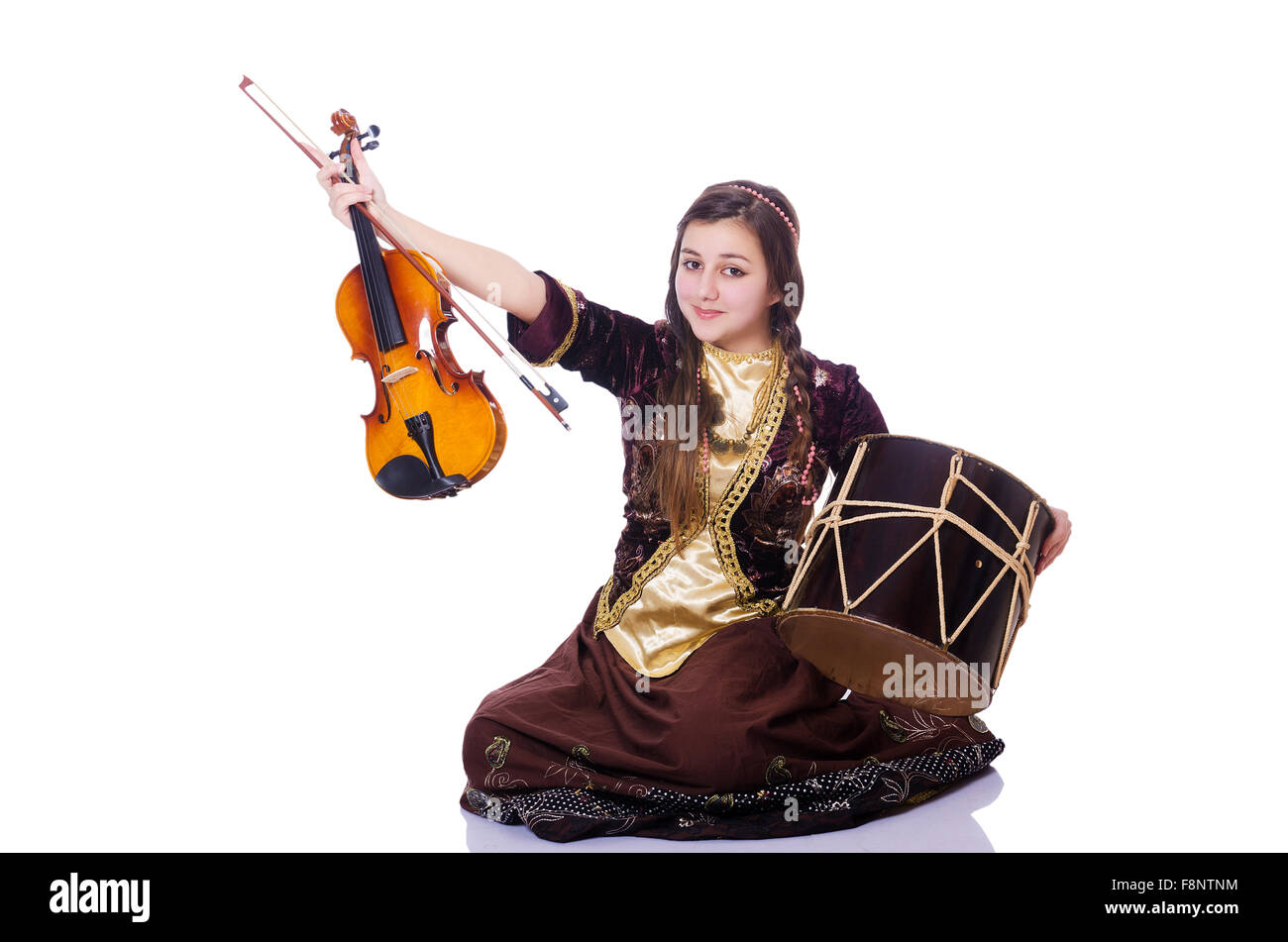 Young woman playing musical instruments on white Stock Photo - Alamy