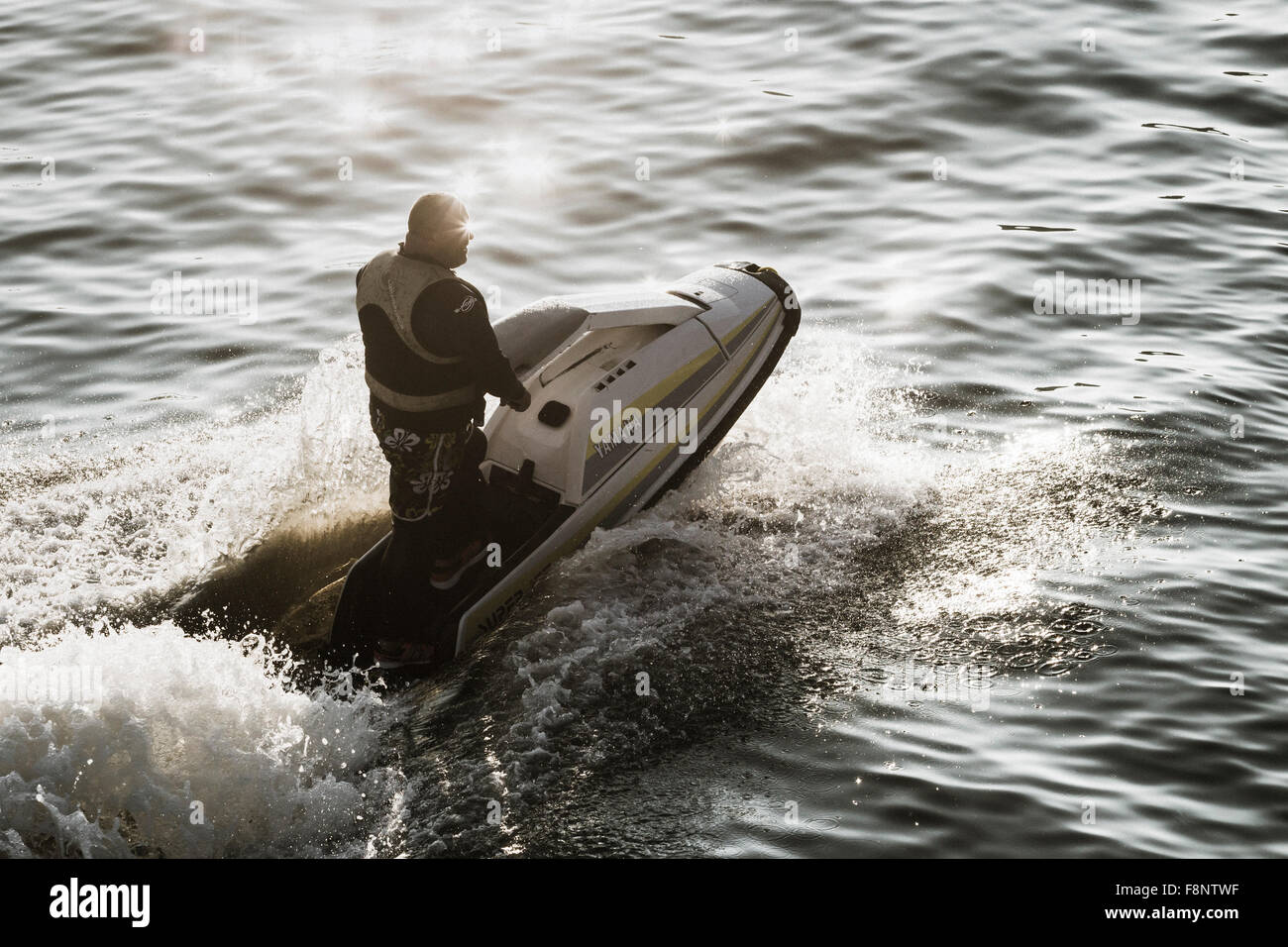 Jet ski at sunset Stock Photo - Alamy
