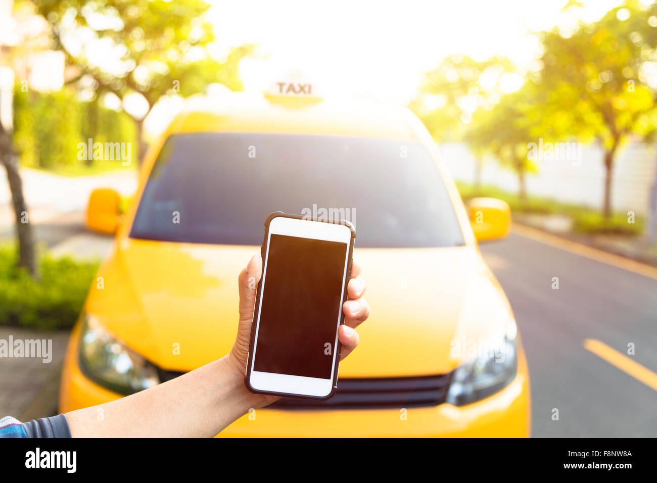 Man orders a taxi from his cell phone Stock Photo - Alamy