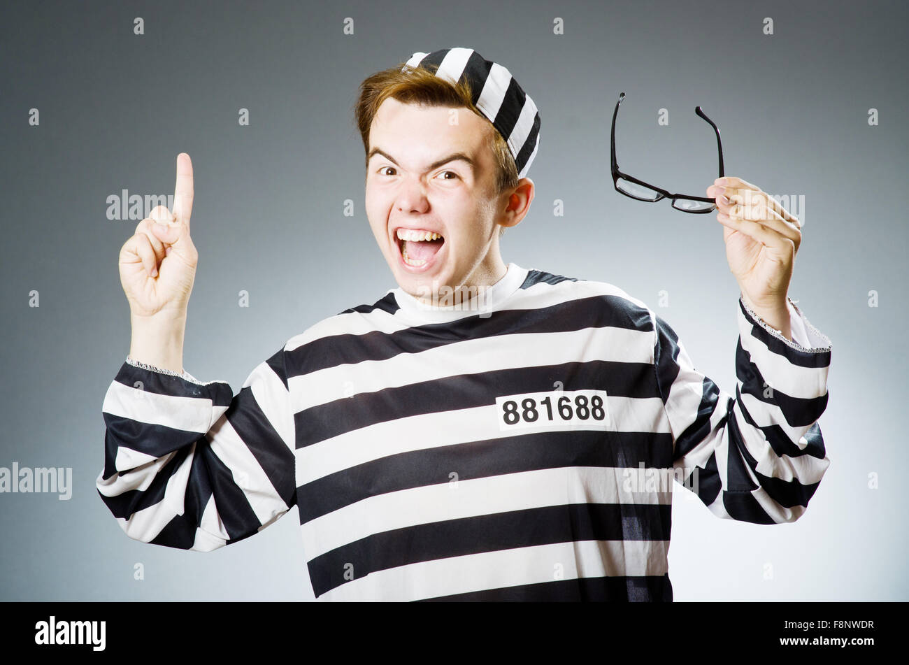 Funny prison inmate in concept Stock Photo - Alamy