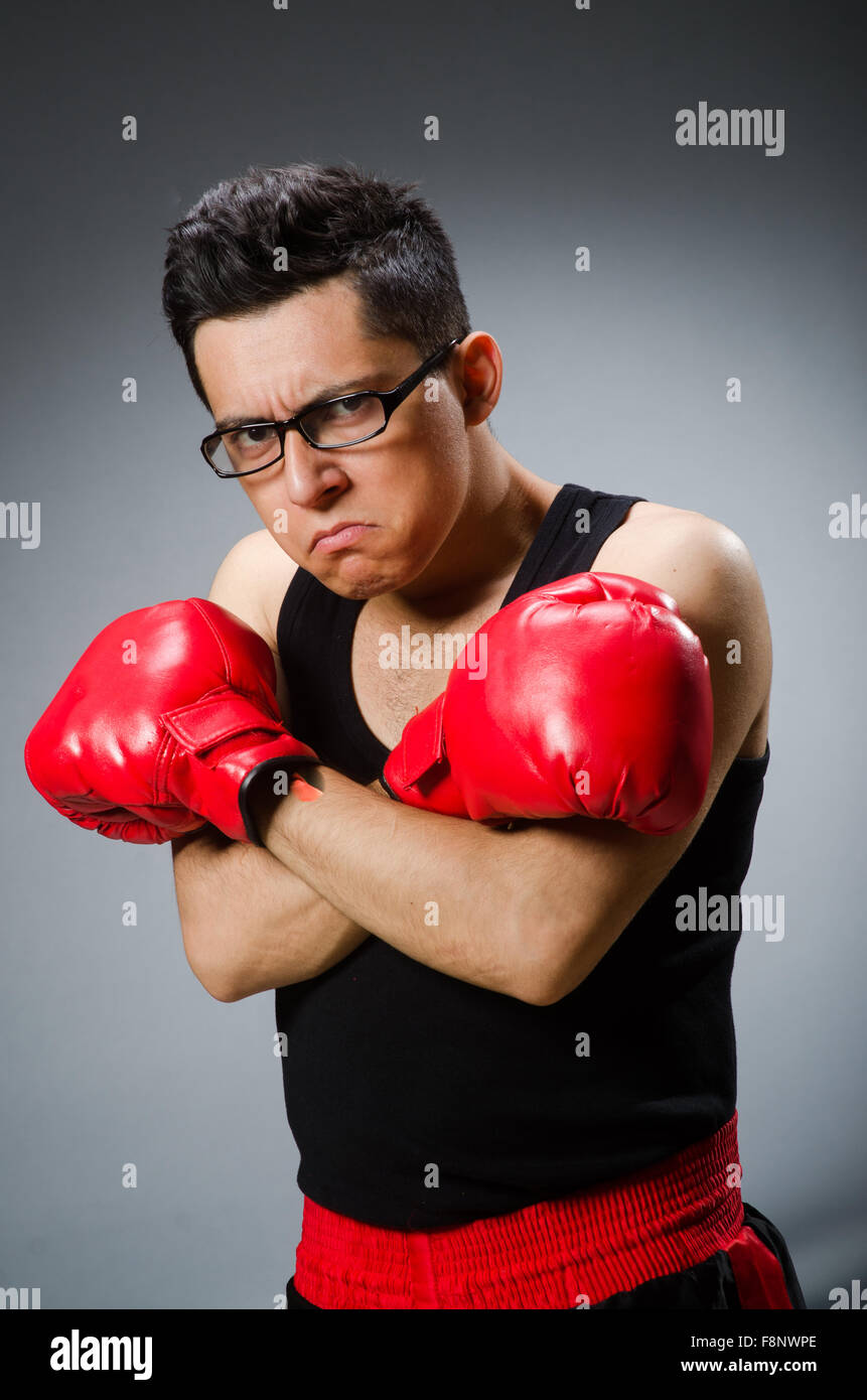 Funny boxer with red gloves against dark background Stock Photo - Alamy