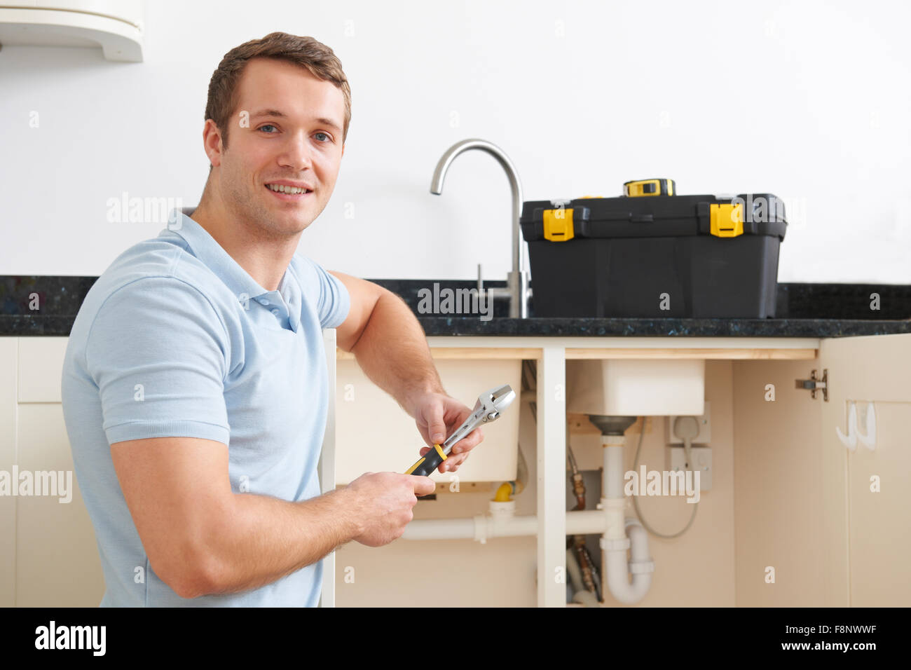 Portrait Of Plumber Fixing Sink Stock Photo - Alamy
