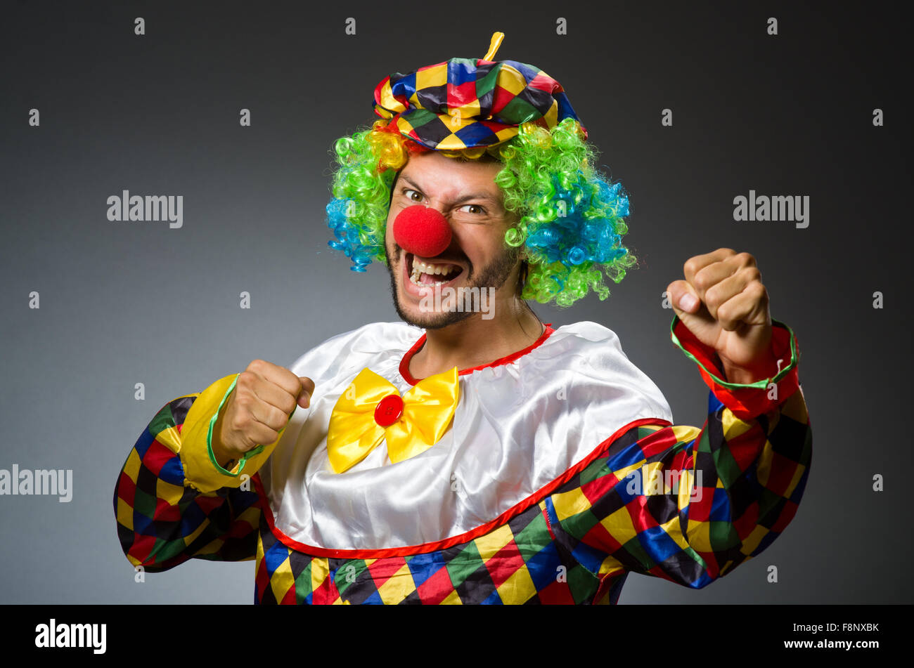Funny clown in colourful costume Stock Photo - Alamy