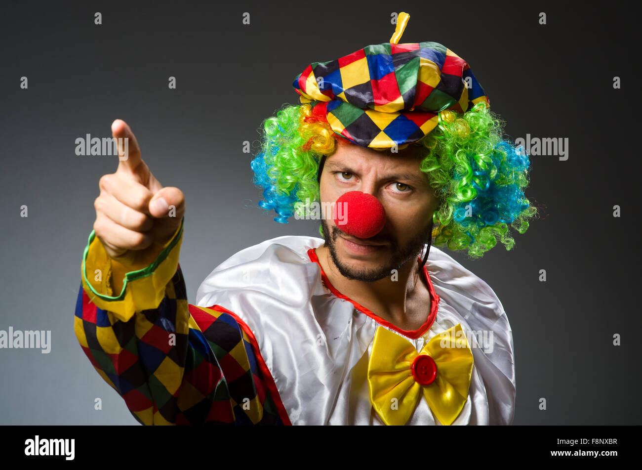 Funny clown in colourful costume Stock Photo - Alamy