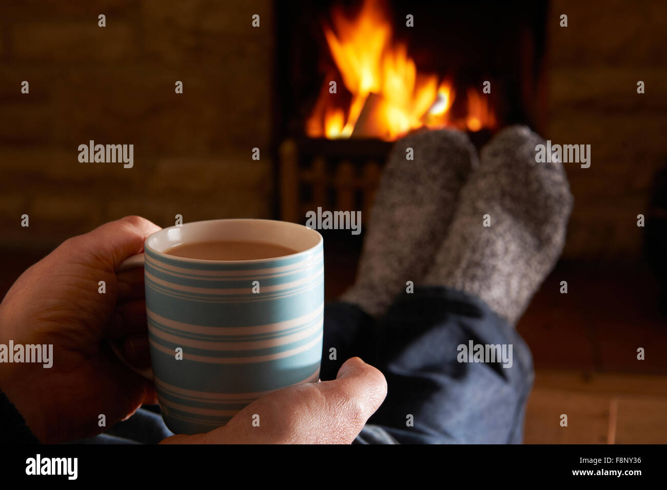 Man sitting fire drink hi-res stock photography and images - Alamy