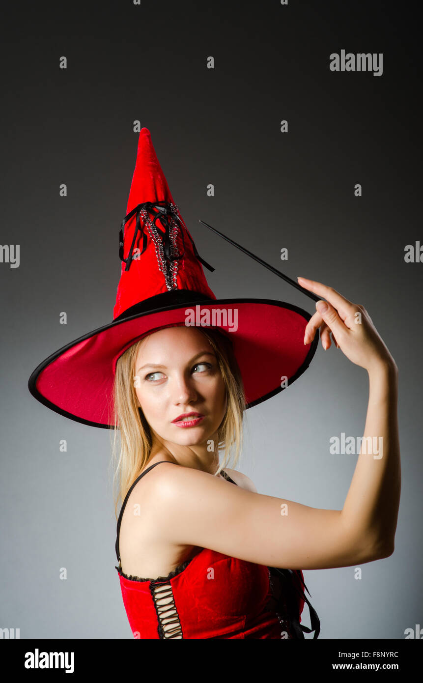 Woman magician doing her tricks with wand Stock Photo - Alamy