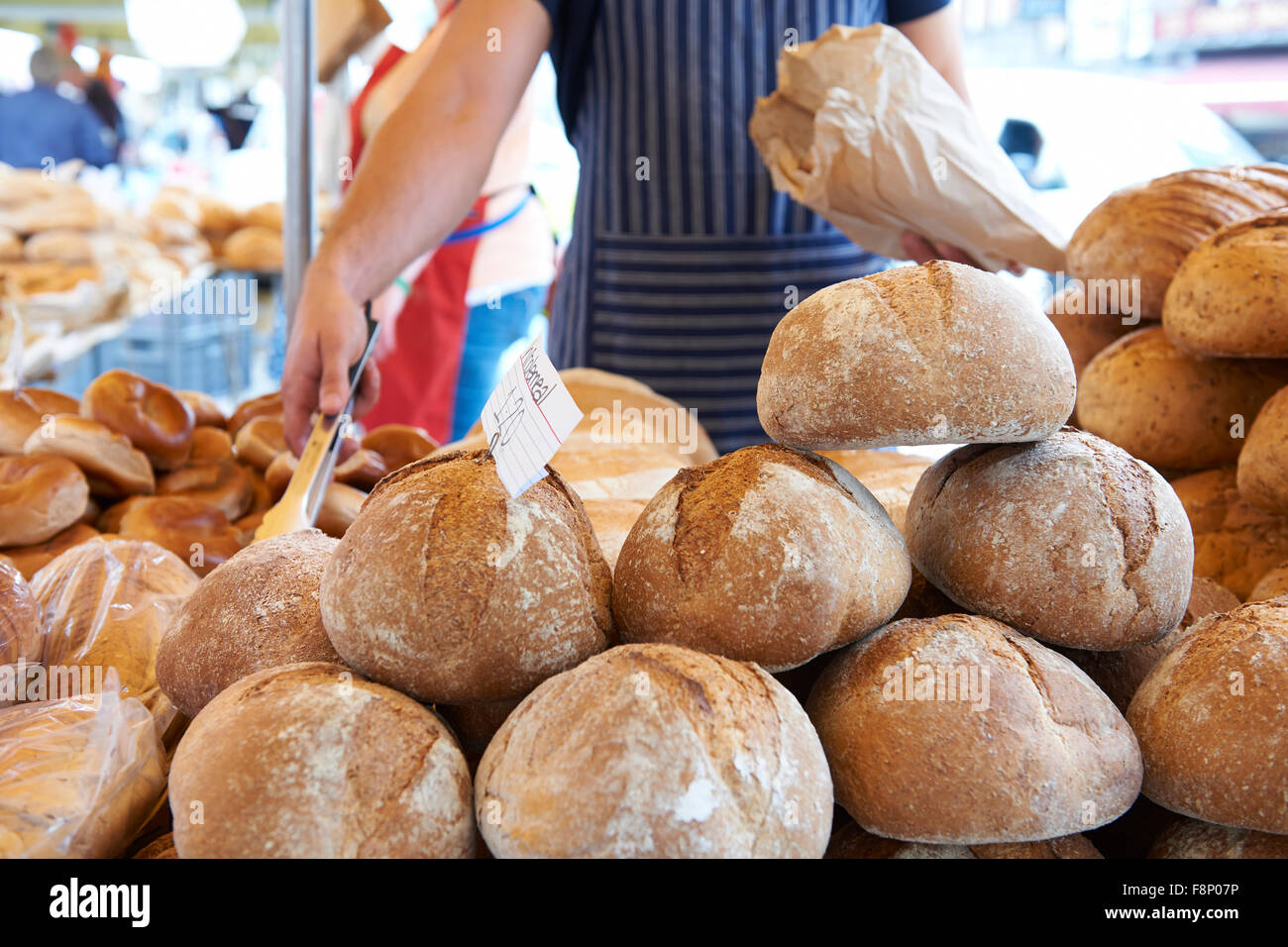 Owner Of Bread Stall At Outdoor Market Stock Photo - Alamy