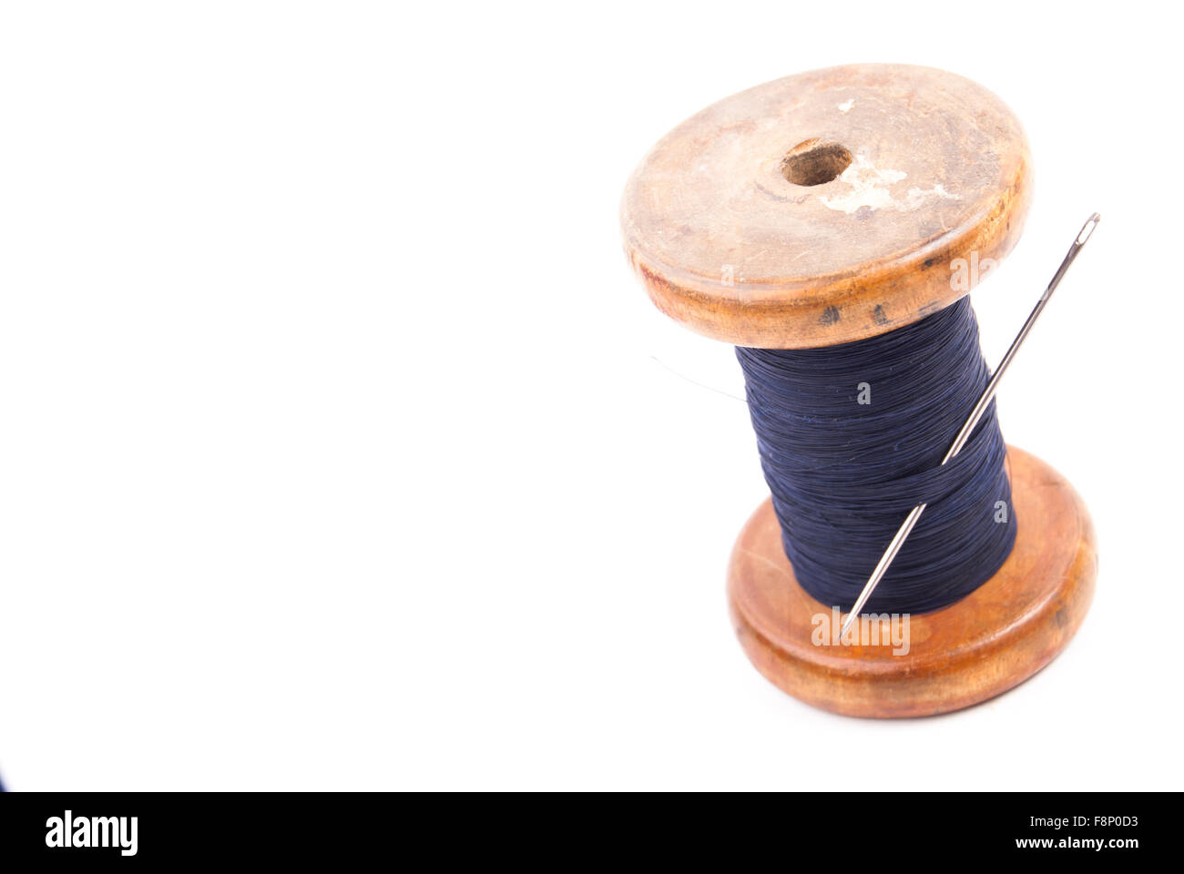 spool of thread with needle Stock Photo - Alamy
