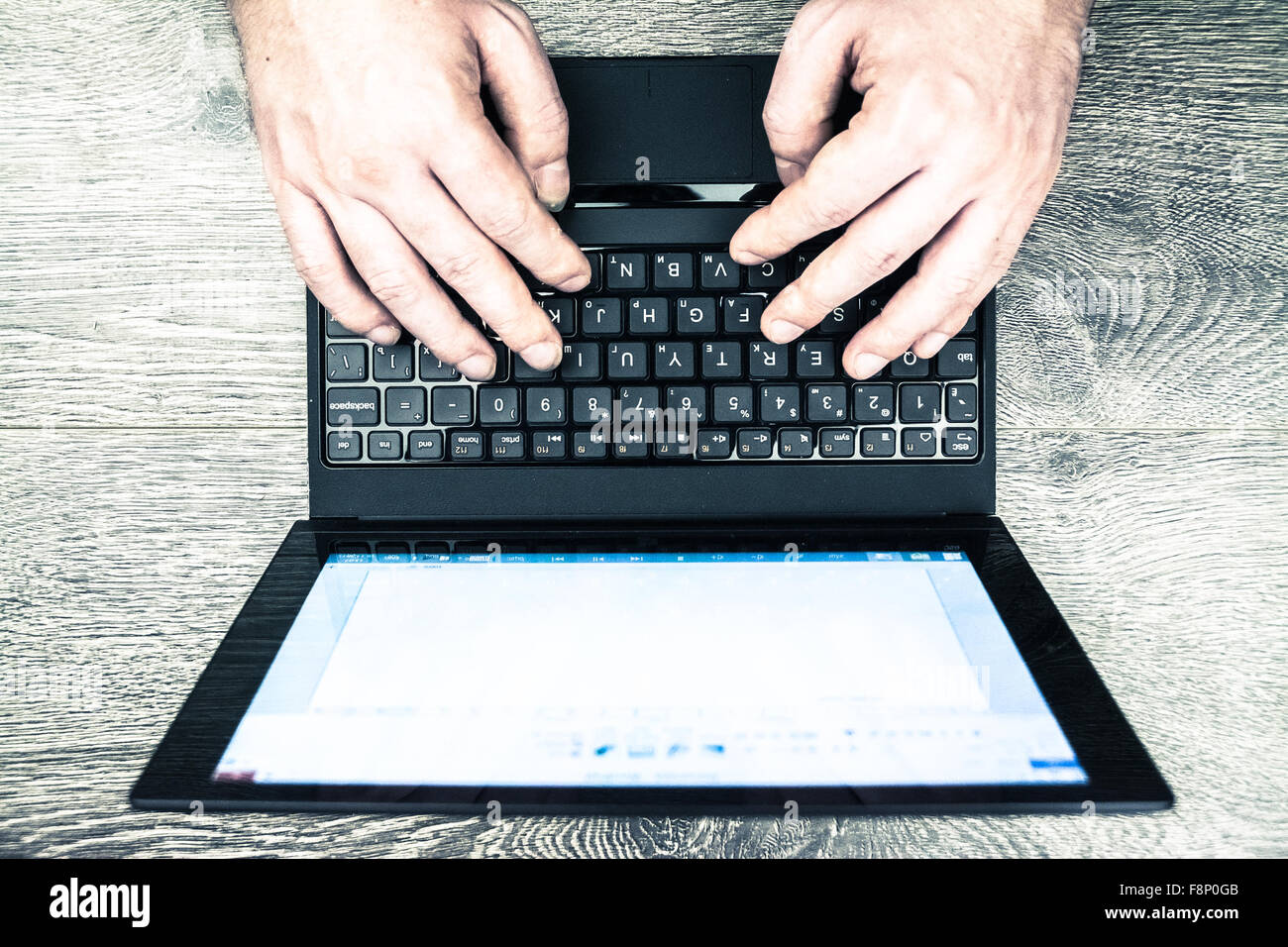 laptop with hands on wood Stock Photo - Alamy