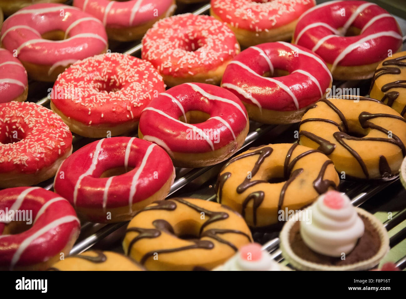Sweet donuts arranged at display Stock Photo - Alamy