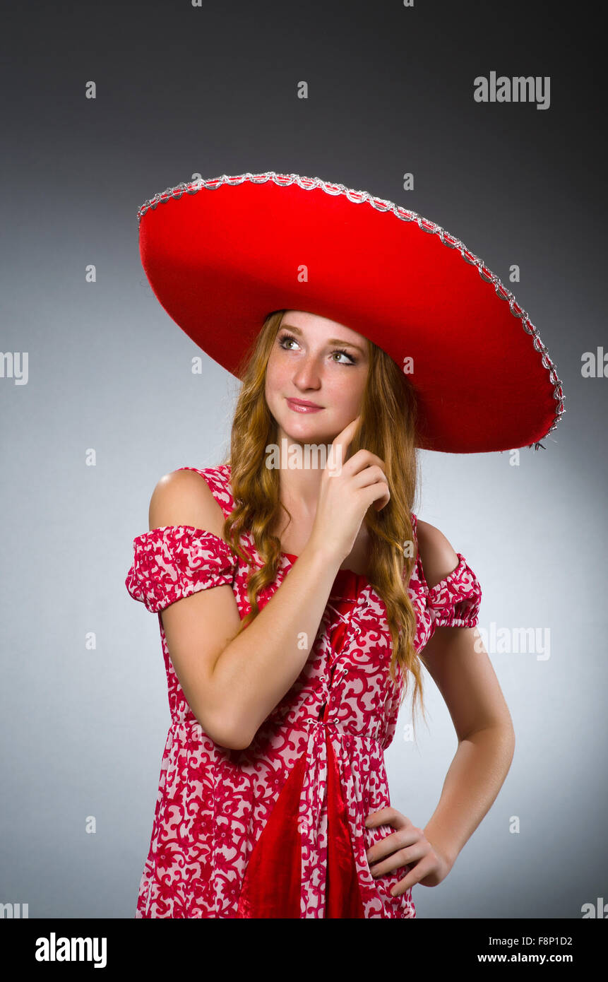 Mexican woman wearing red sombrero Stock Photo - Alamy