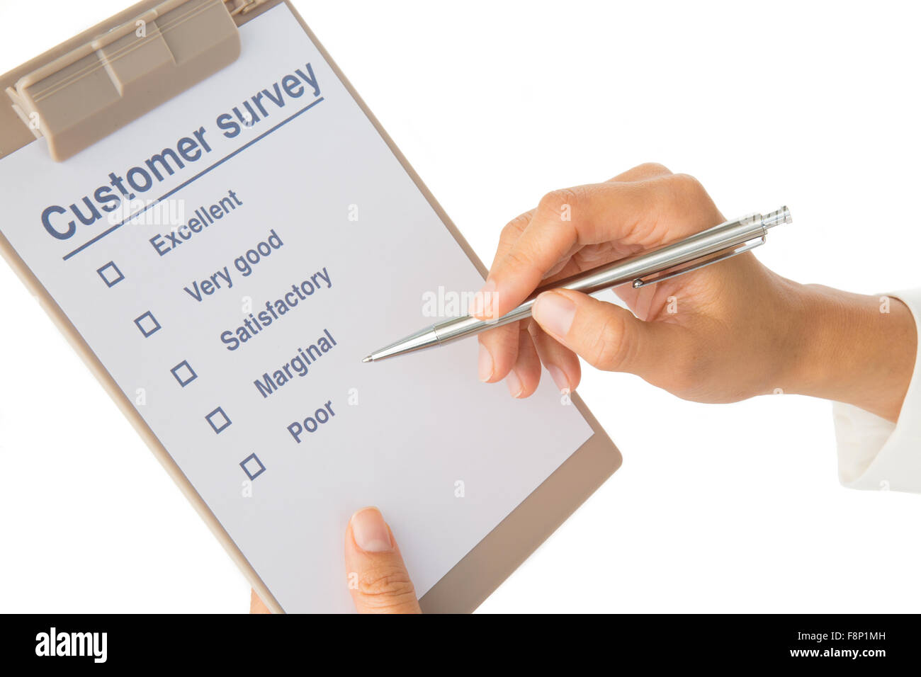 Woman's hand fills out customer survey on white Stock Photo - Alamy