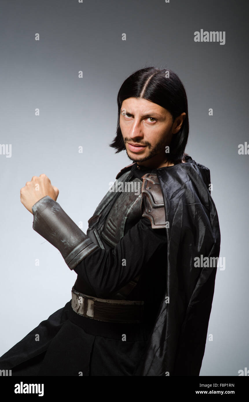 Angry warrior against dark background Stock Photo - Alamy