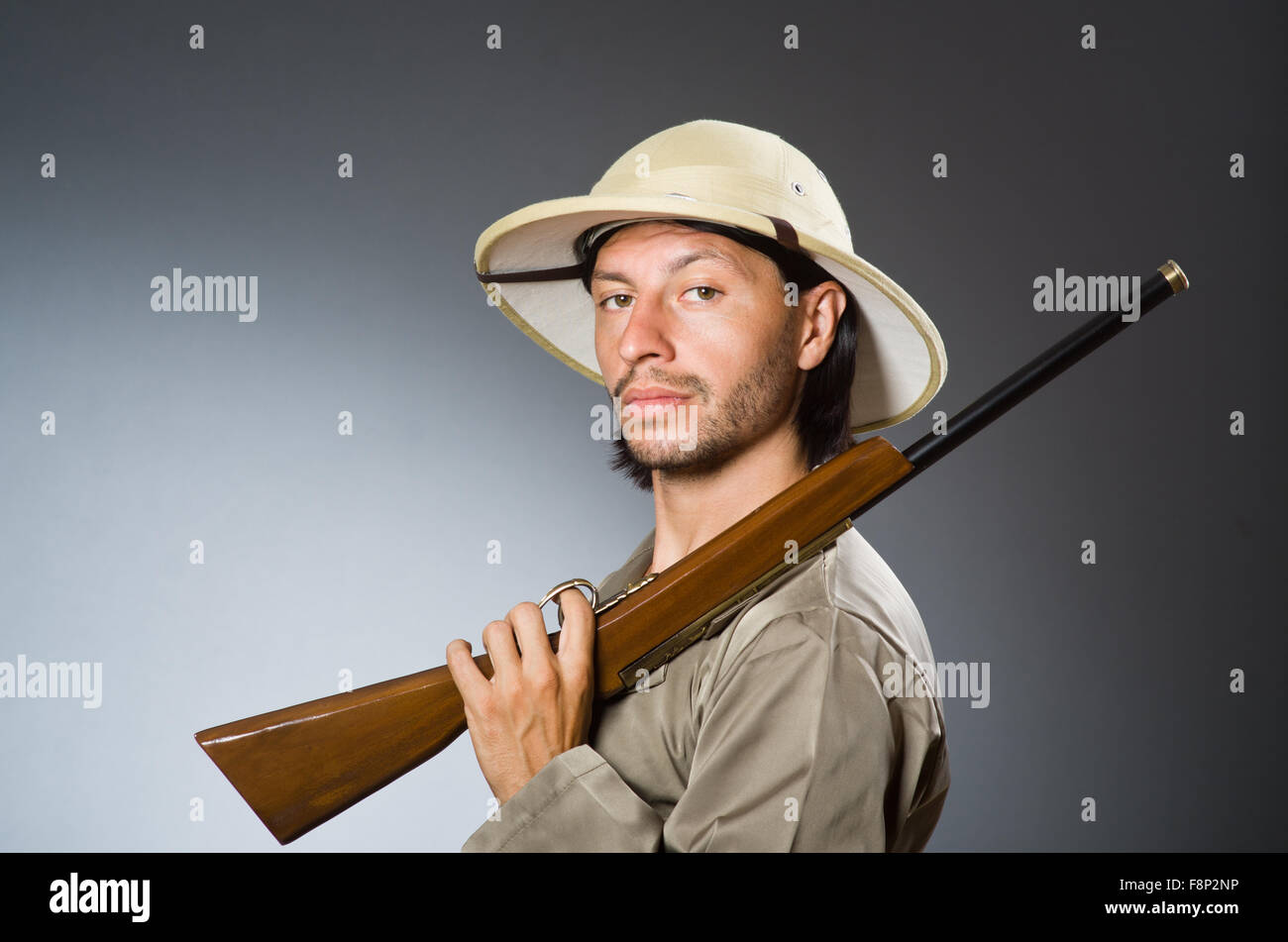 Funny safari hunter with rifle Stock Photo - Alamy