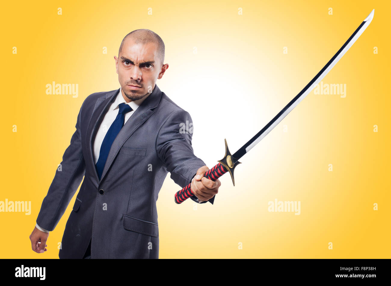 Businessman with sword isolated on white Stock Photo - Alamy