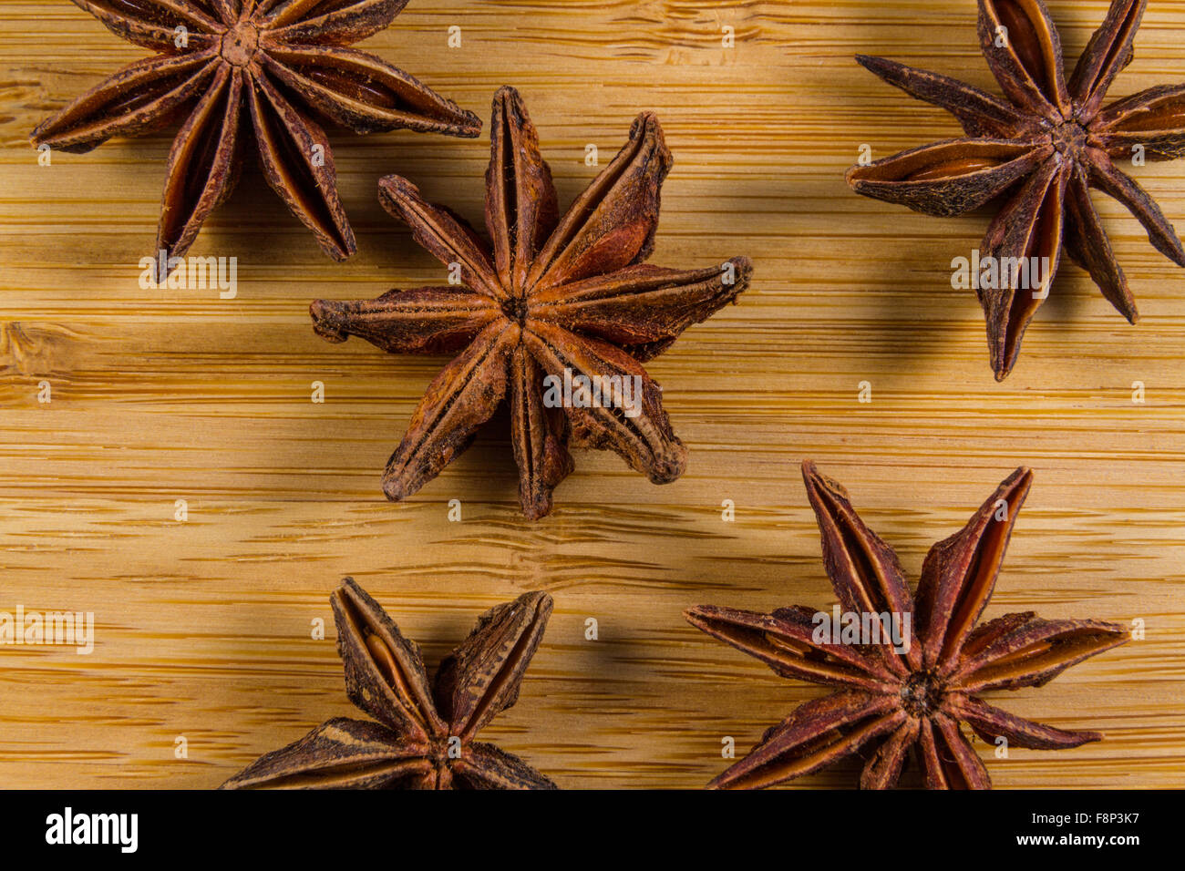 Close up of star anise spice, wood background, macro Stock Photo - Alamy