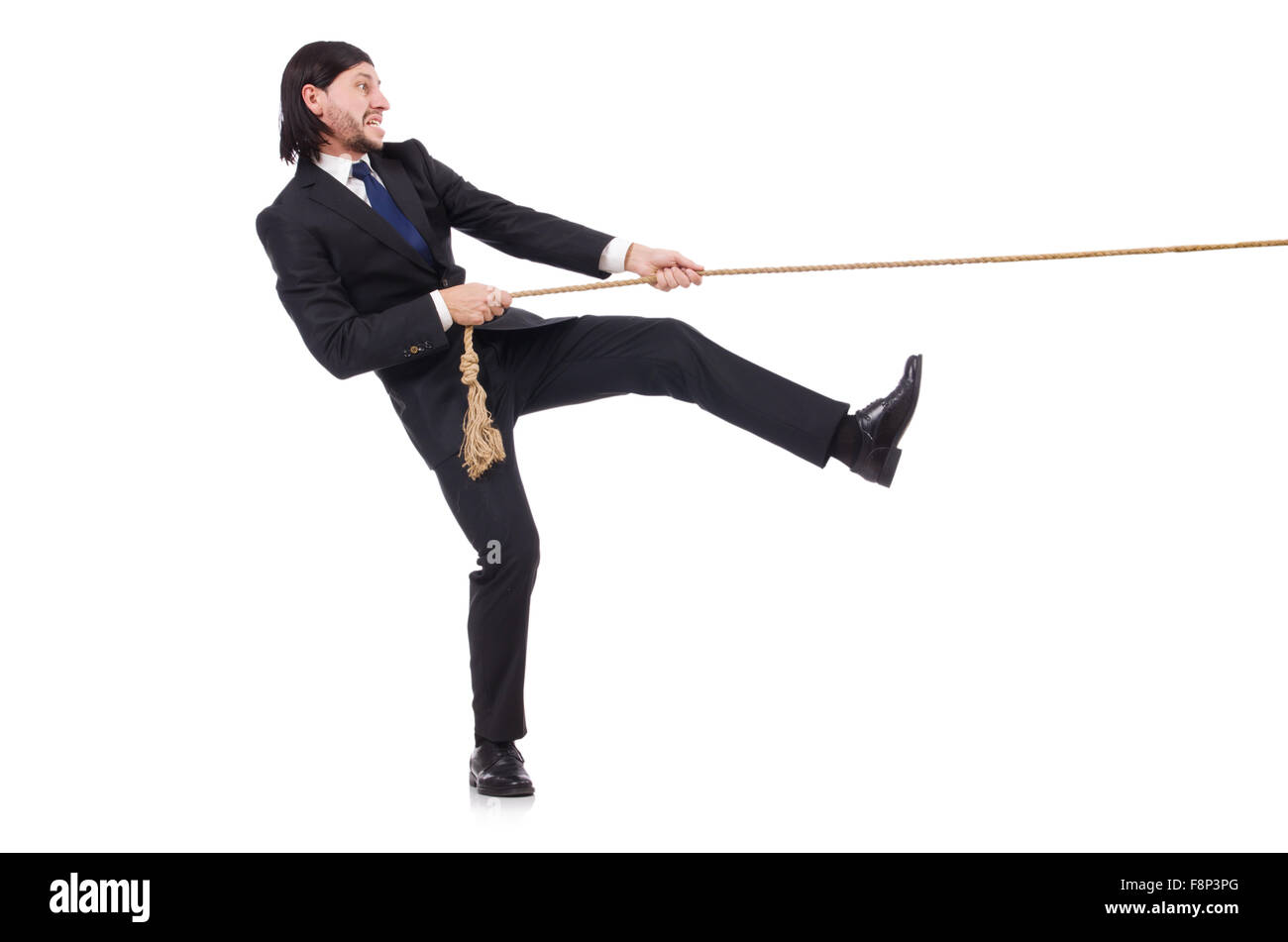 Young businessman pulling rope isolated on white Stock Photo - Alamy