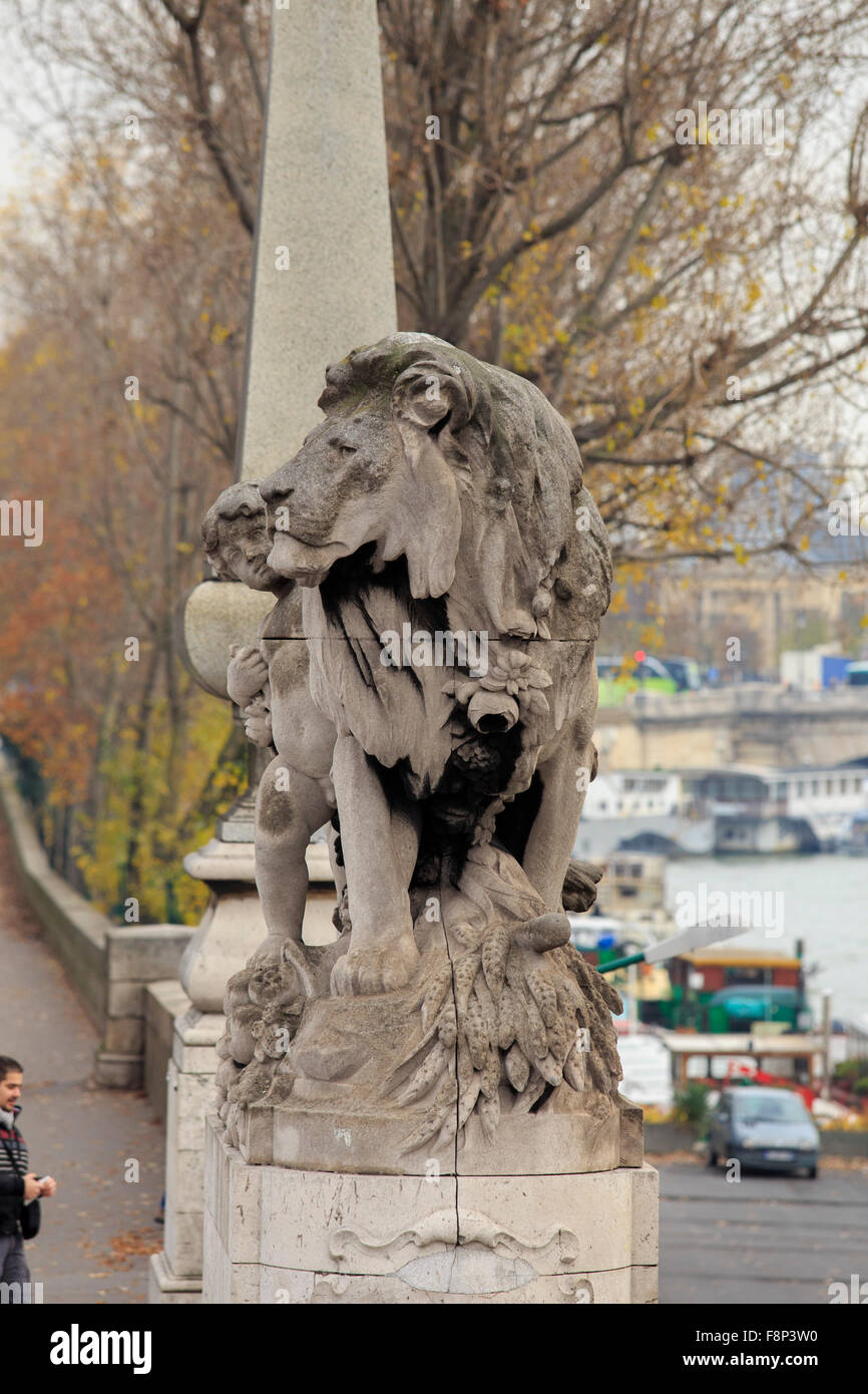 A statue of a lion on the streets of Paris, France near Les Invalides ...