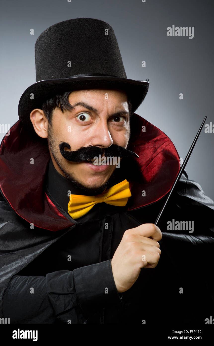 Funny magician man with wand and hat Stock Photo - Alamy