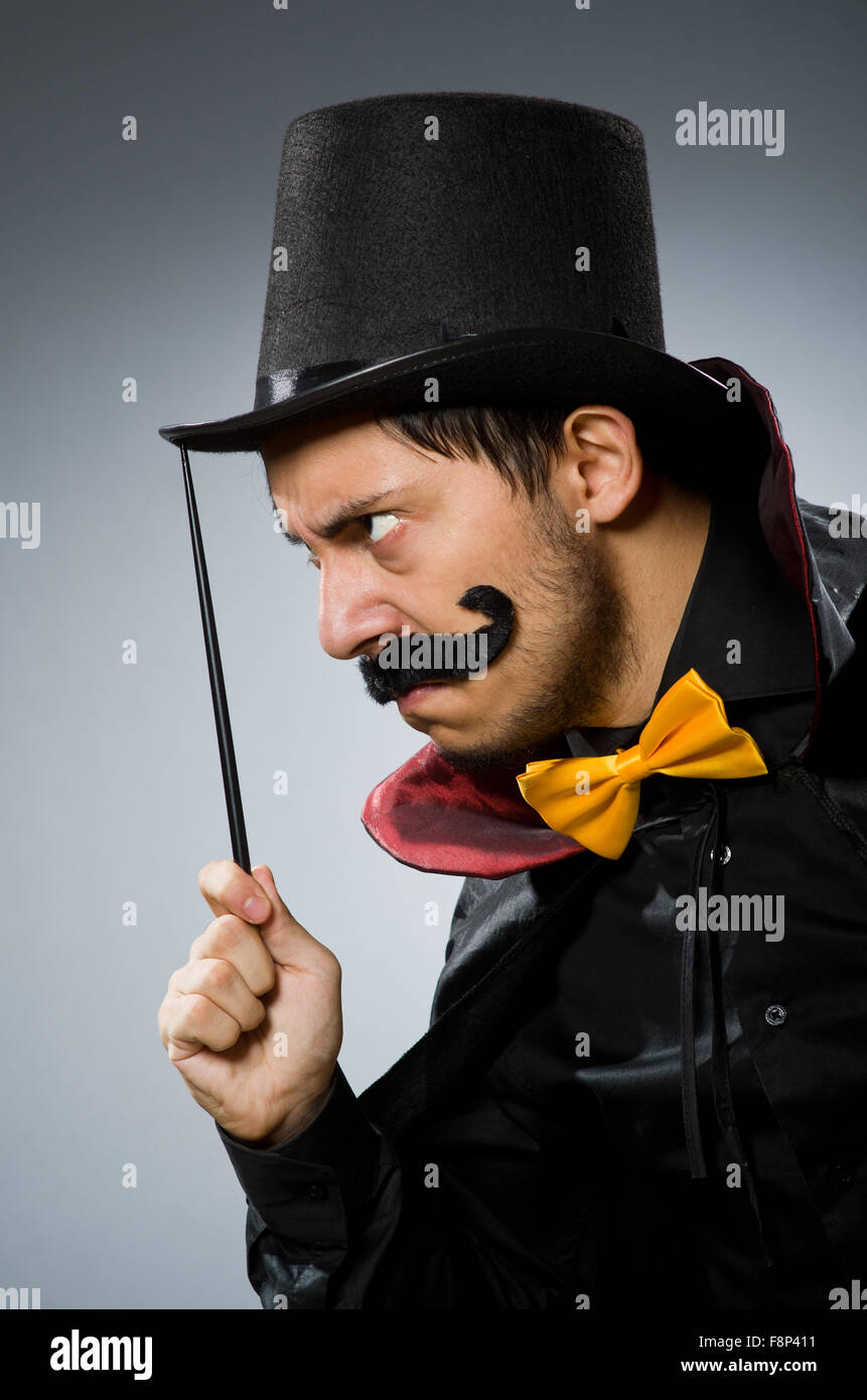 Funny magician man with wand and hat Stock Photo - Alamy