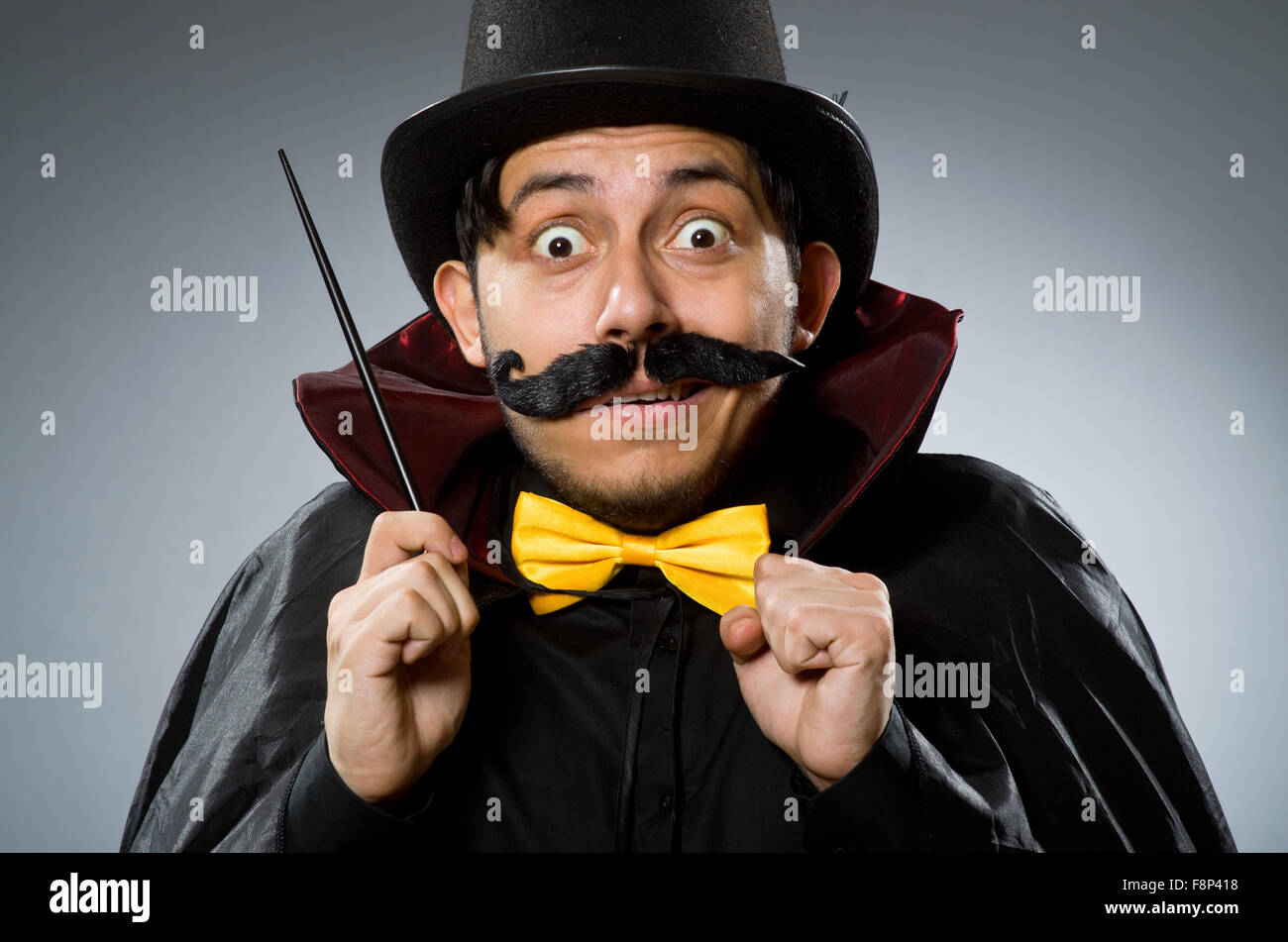 Funny magician man with wand and hat Stock Photo - Alamy