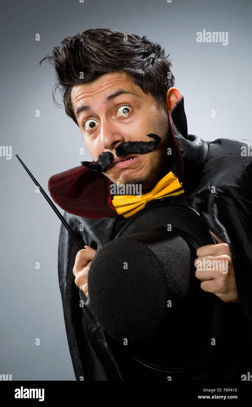 Funny magician man with wand and hat Stock Photo - Alamy