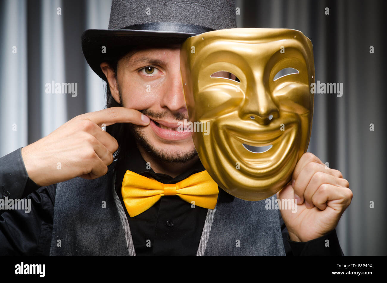Funny concept with theatrical mask Stock Photo - Alamy