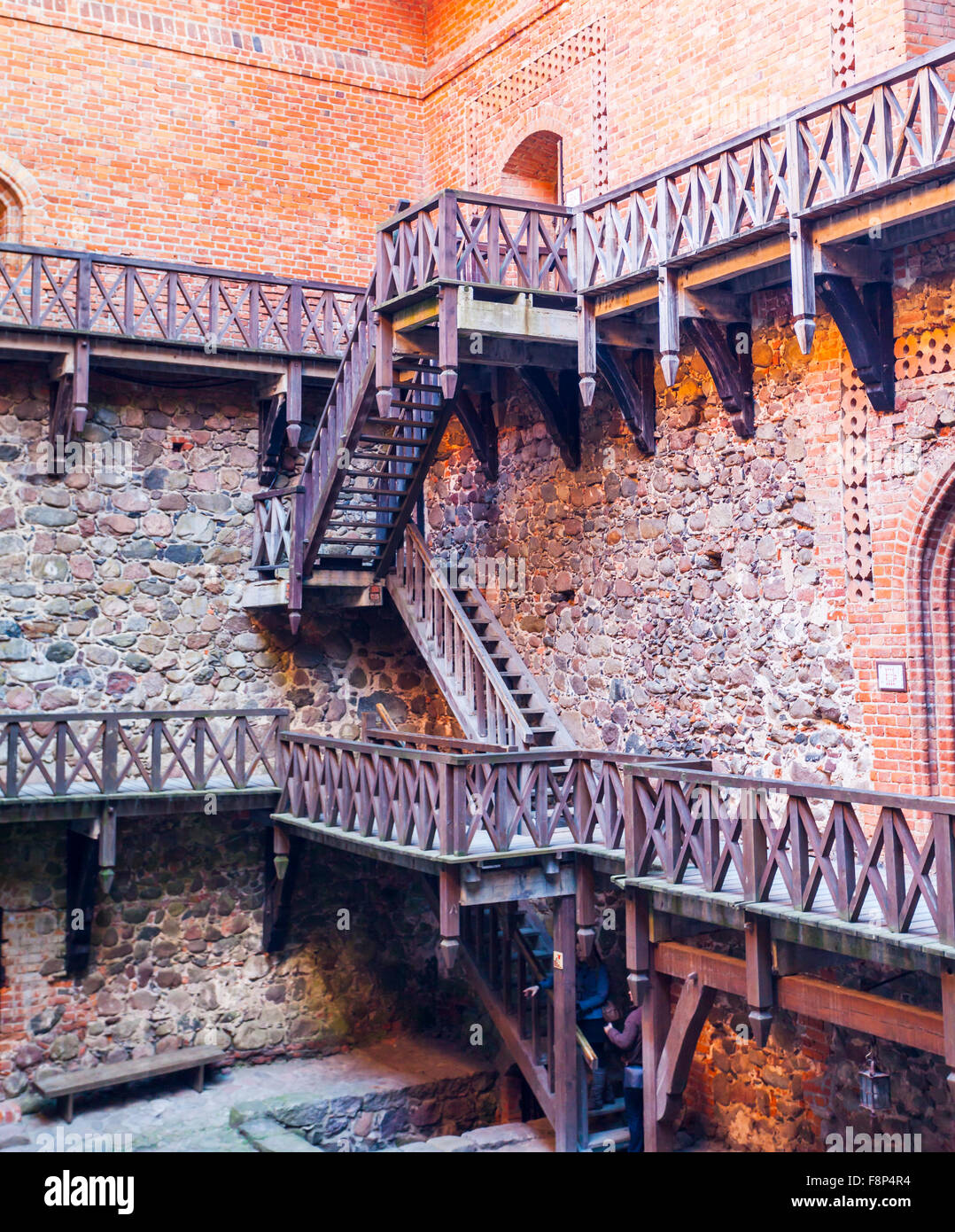 Interior courtyard with wooden walkways and staircases of Trakai Castle ...