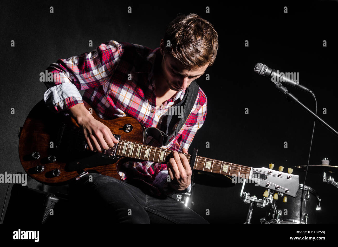 Man with guitar during concert Stock Photo - Alamy