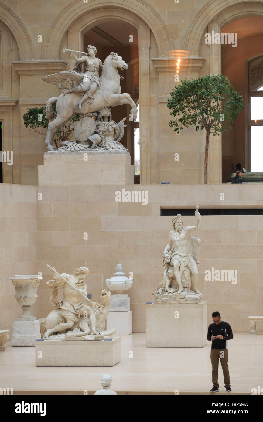 Giant sculptures of ancient Greek Gods in the foyer of The Louvre ...