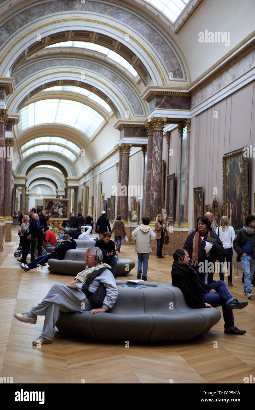 Visitors take a rest surrounded by beautiful painting and art work in ...