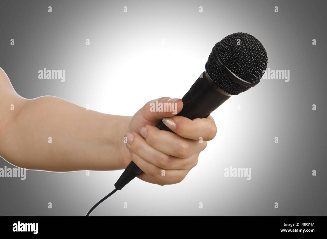 Hand with microphone on white Stock Photo - Alamy