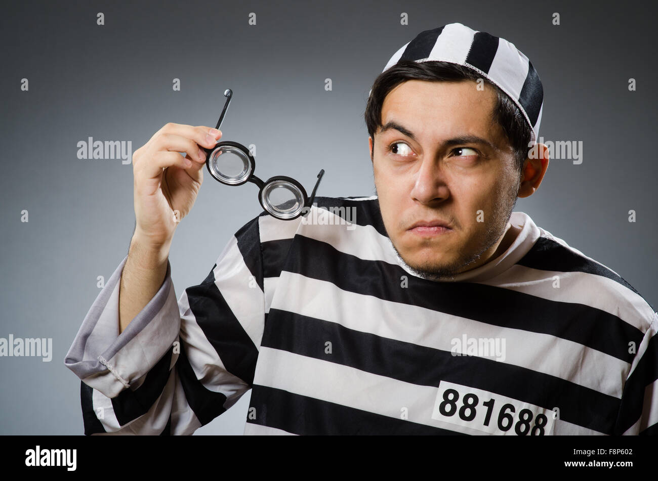 Prison inmate in funny concept Stock Photo - Alamy