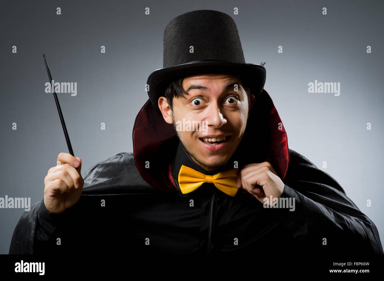 Funny magician man with wand and hat Stock Photo - Alamy