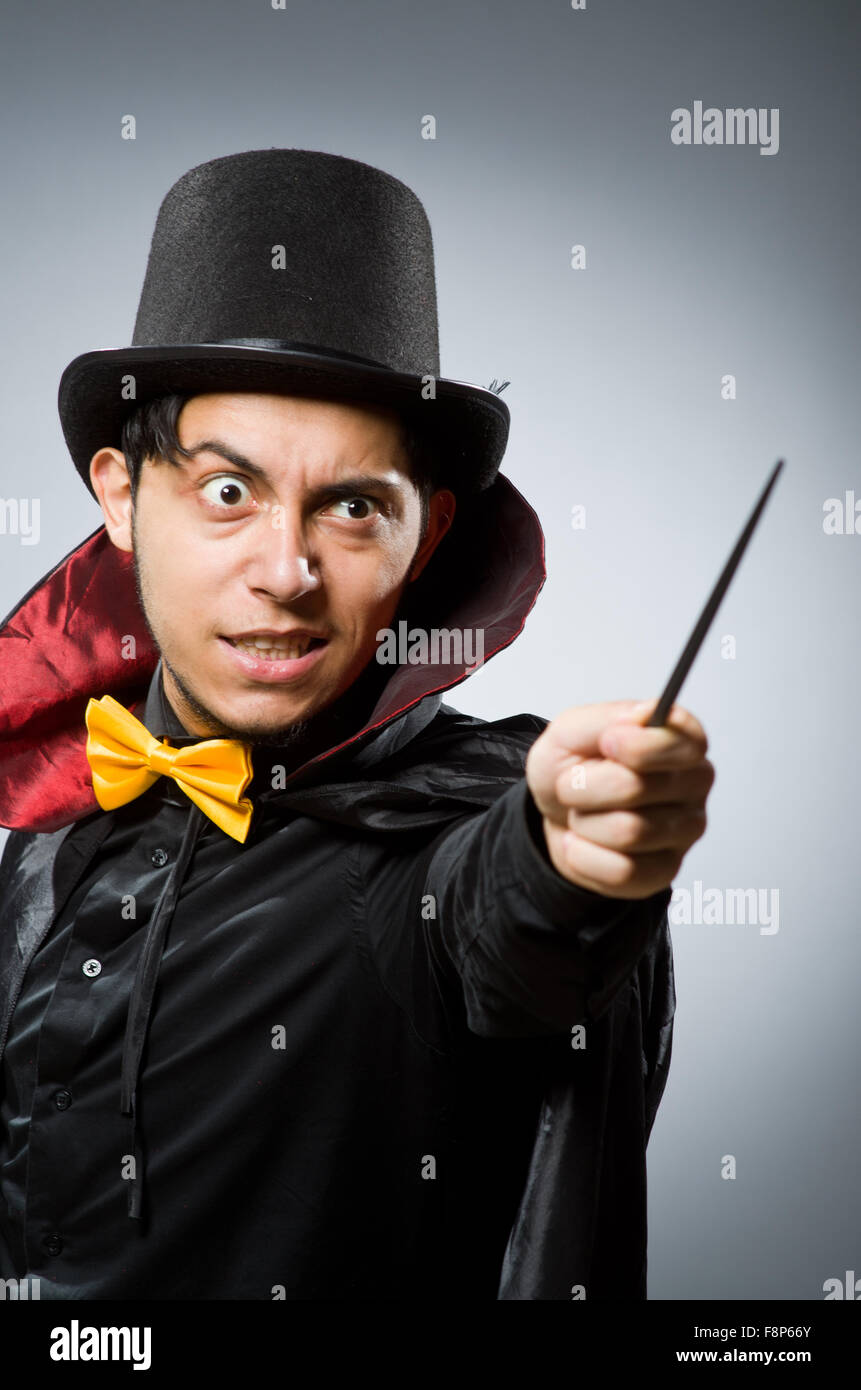 Funny magician man with wand and hat Stock Photo - Alamy