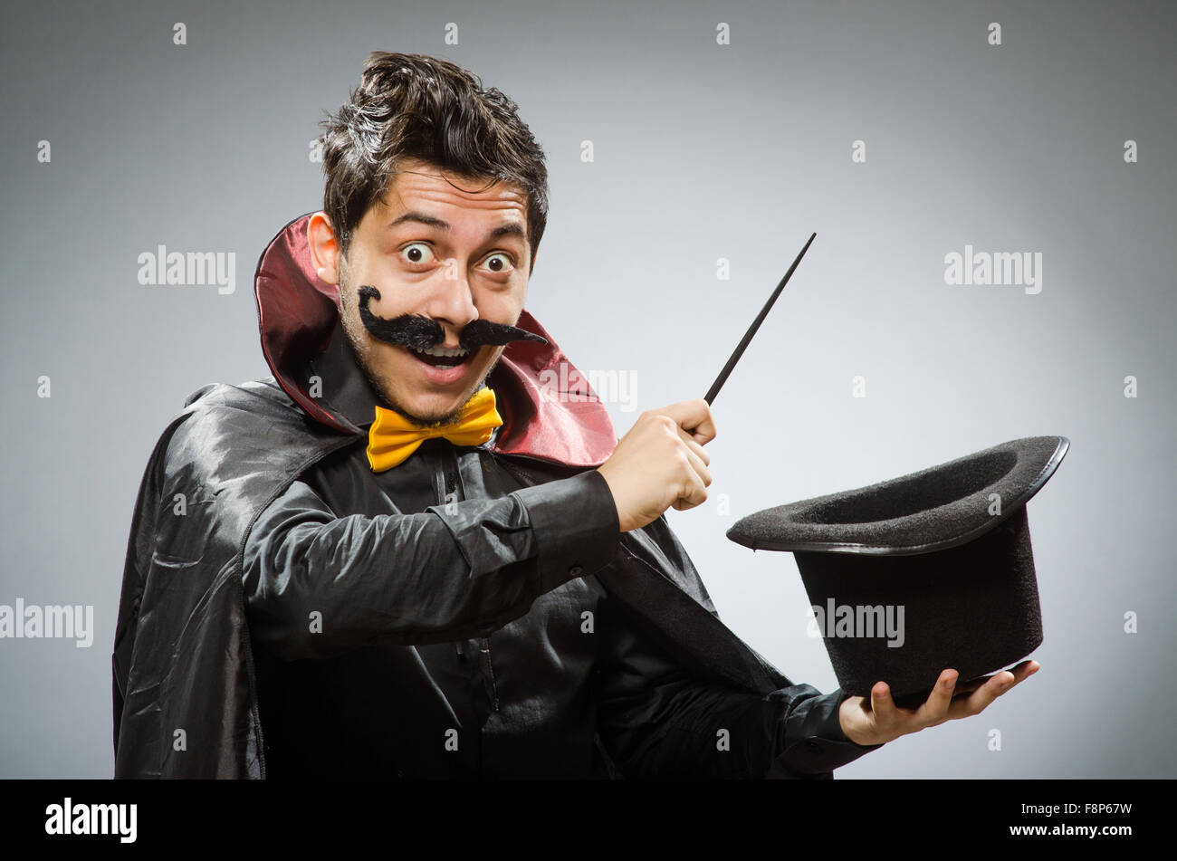 Funny magician man with wand and hat Stock Photo - Alamy