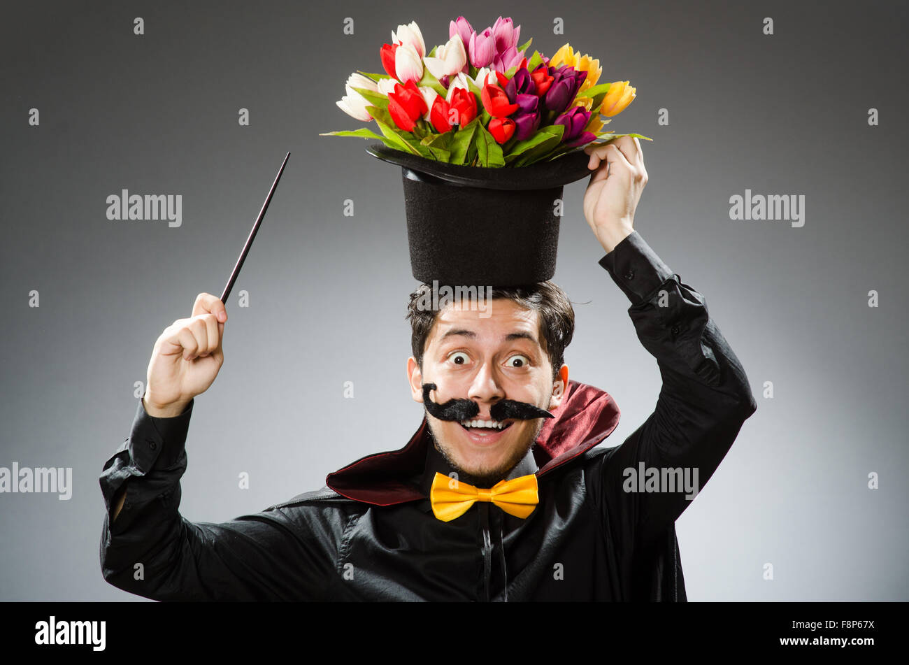 Funny magician man with wand and hat Stock Photo - Alamy
