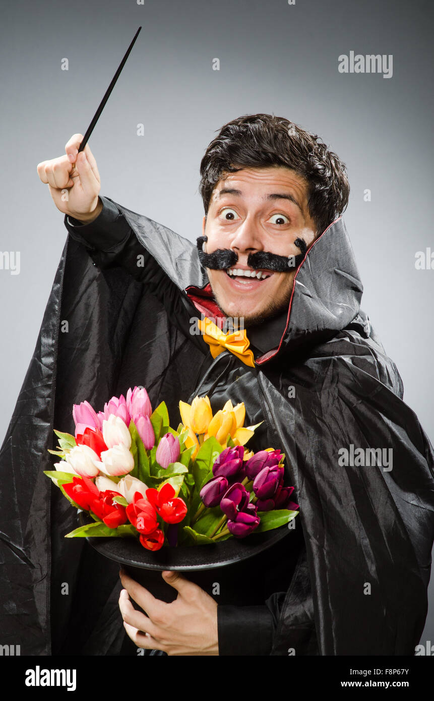 Funny magician man with wand and hat Stock Photo - Alamy