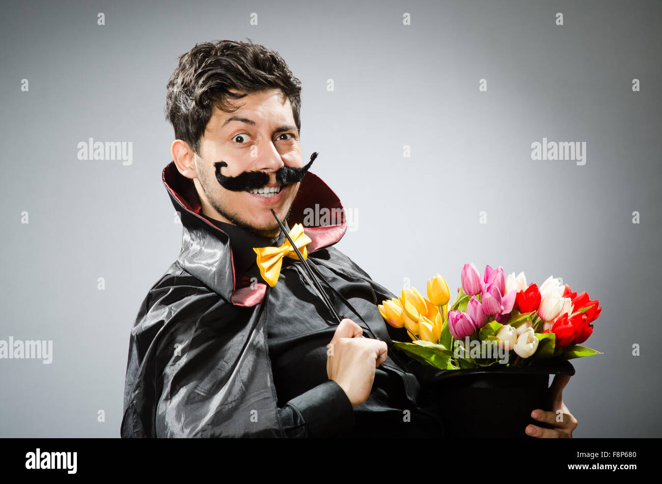 Funny magician man with wand and hat Stock Photo - Alamy