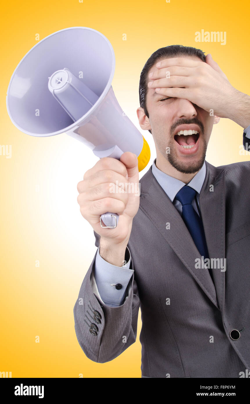 Man shouting and yelling with loudspeaker Stock Photo - Alamy