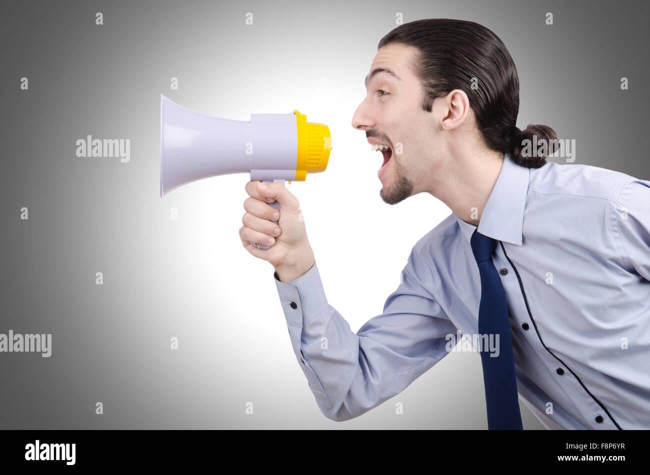 Man shouting and yelling with loudspeaker Stock Photo - Alamy