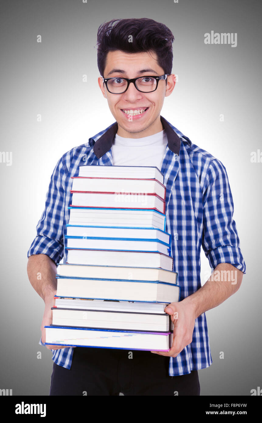 Student with lots of books on white Stock Photo - Alamy