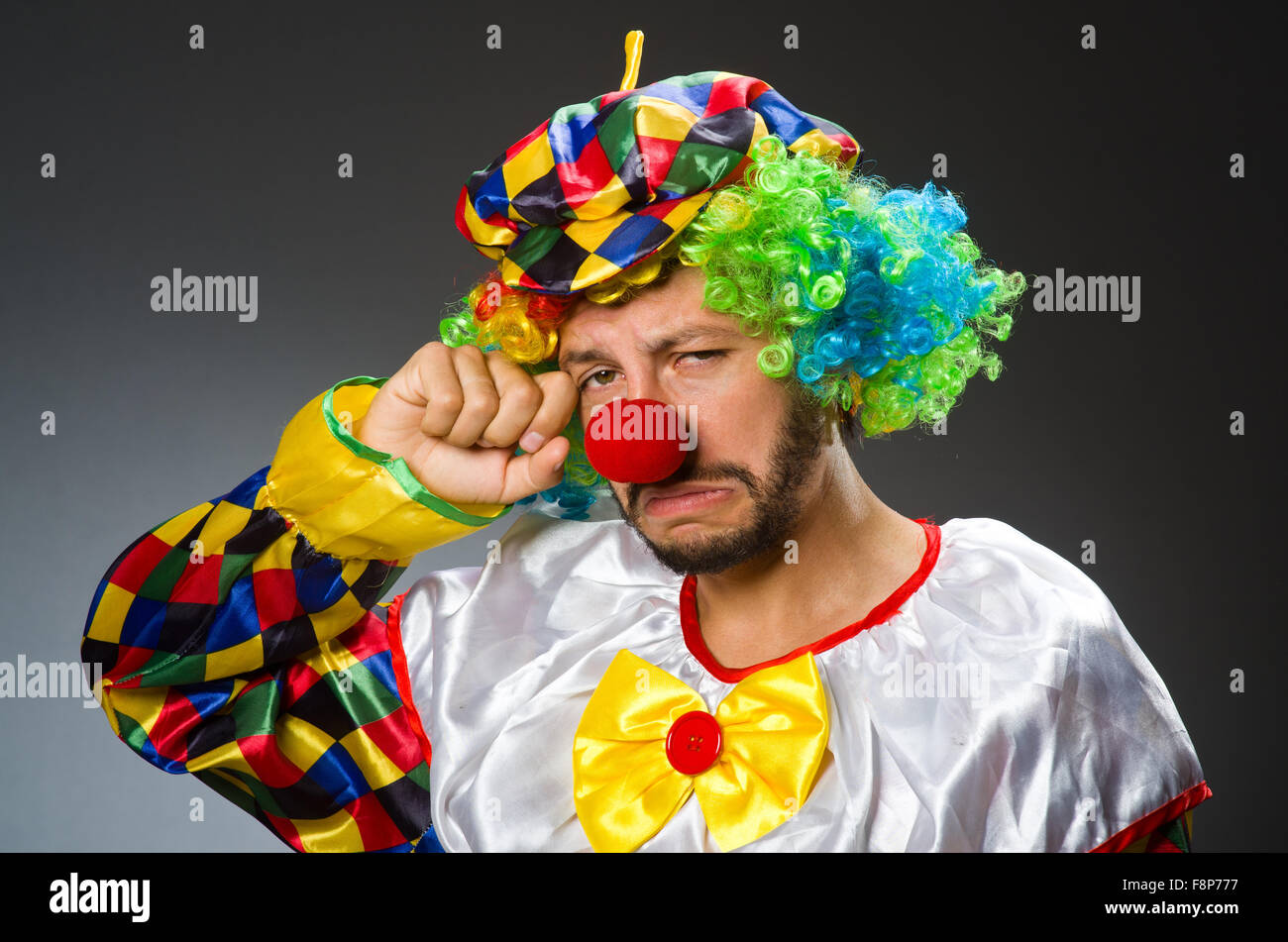 Funny clown in colourful costume Stock Photo - Alamy