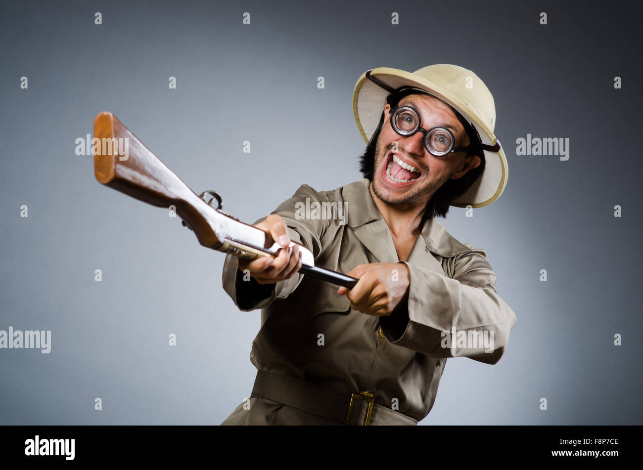 Funny safari hunter with rifle Stock Photo - Alamy