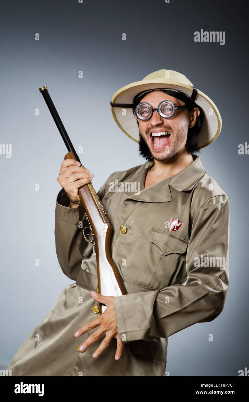Funny safari hunter with rifle Stock Photo - Alamy