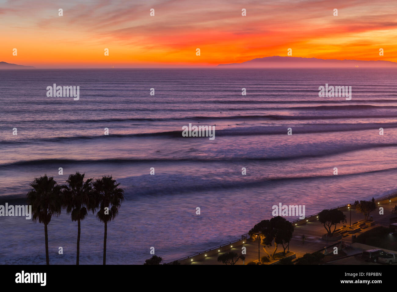 Palm trees sunset ocean waves surf hi-res stock photography and images ...