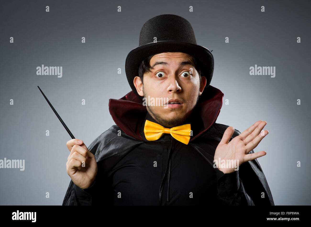 Funny magician man with wand and hat Stock Photo - Alamy