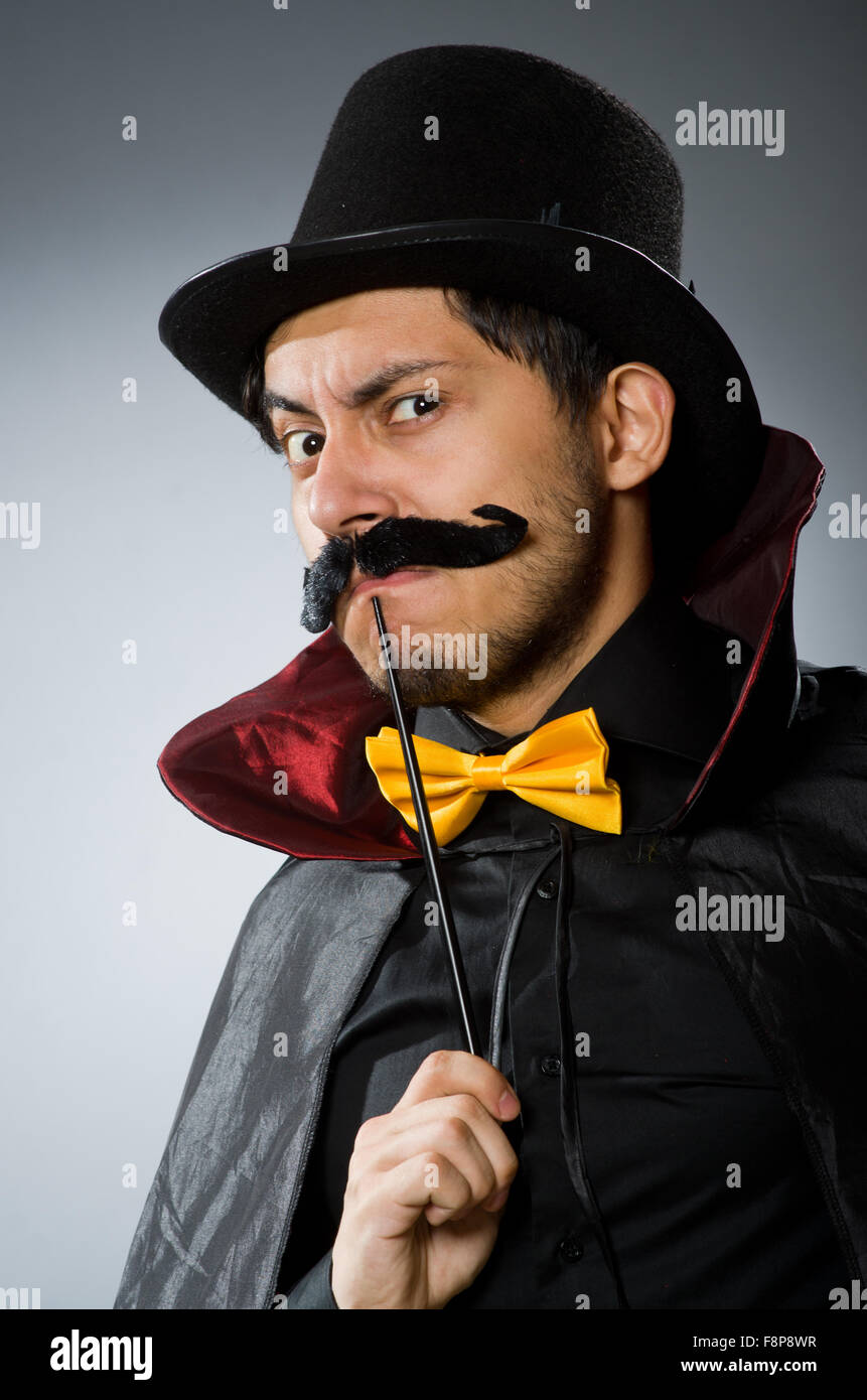 Funny magician man with wand and hat Stock Photo - Alamy
