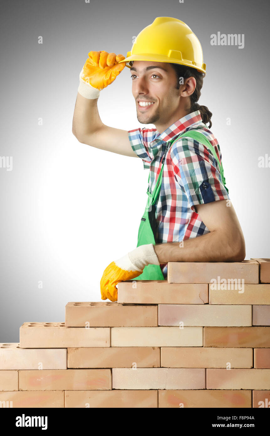Builder with hard hat on white Stock Photo - Alamy