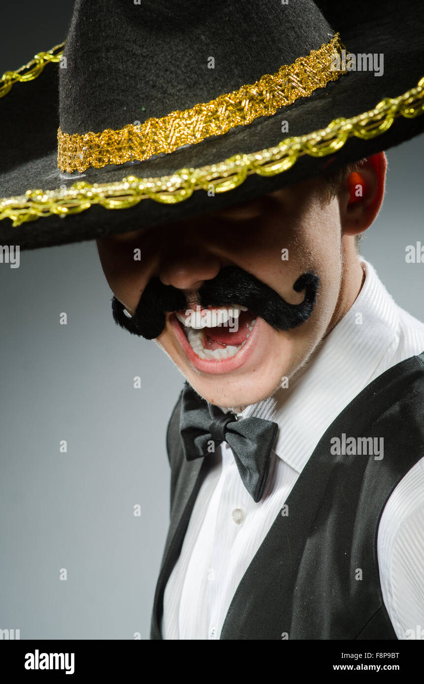 Smiling mexican with sombrero isolated on white Stock Photo - Alamy